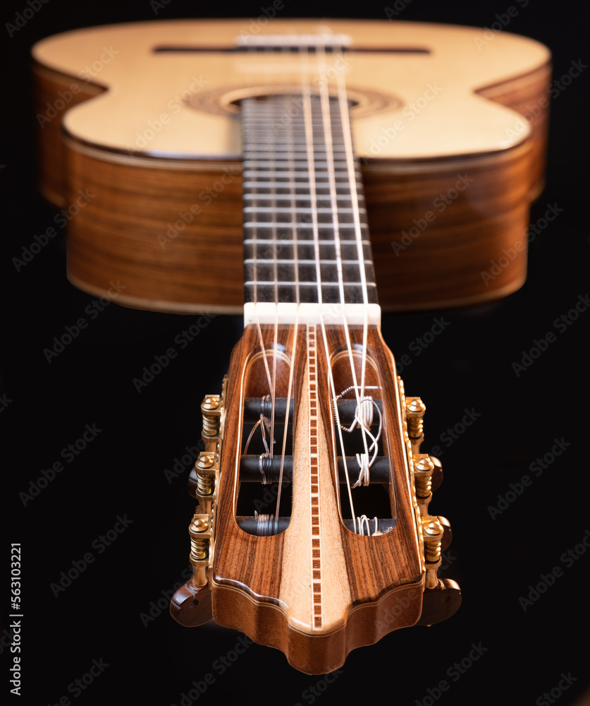 Classical guitar headstock detail isolated on black background. Classic ...