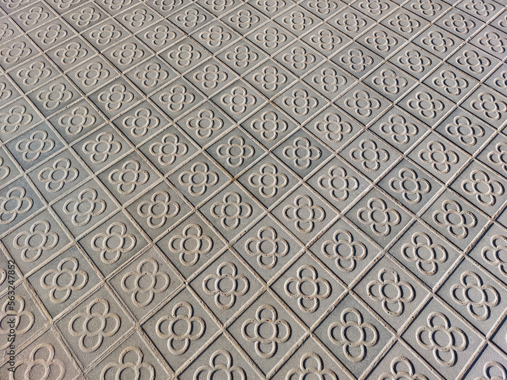 Pavement in Barcelona made of small tiles with the traditional pattern ...