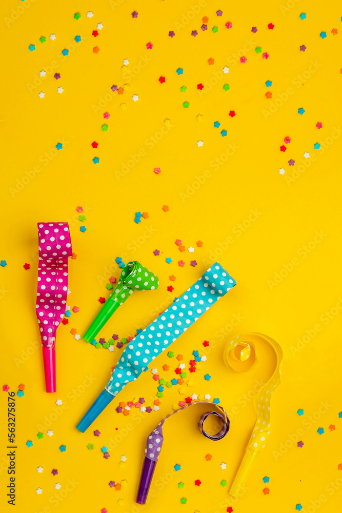 Abstract colored party background. Multi-colored party horns ...