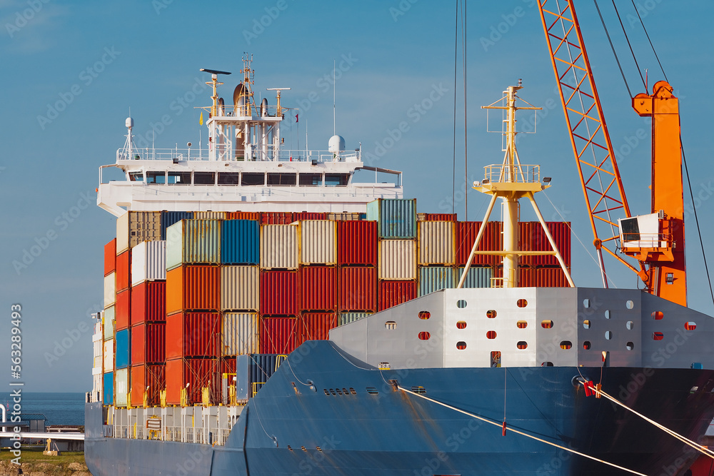 container ship uploading in commercial dock harbor Stock Photo | Adobe ...