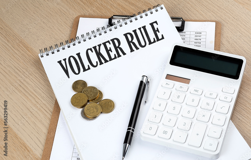 VOLCKER RULE text with chart and calculator and coins , business ...