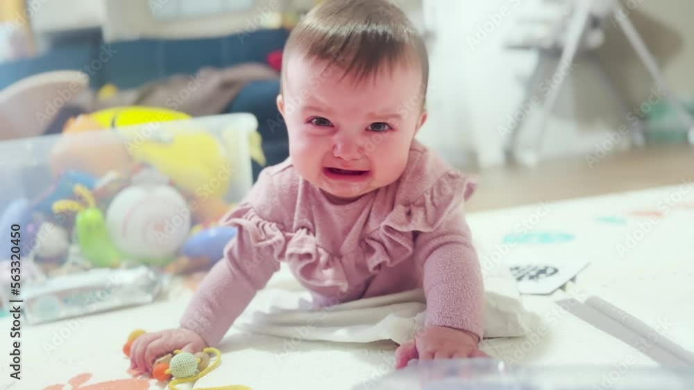 baby a newborn crying. little girl 6 months upset crying sad facial ...