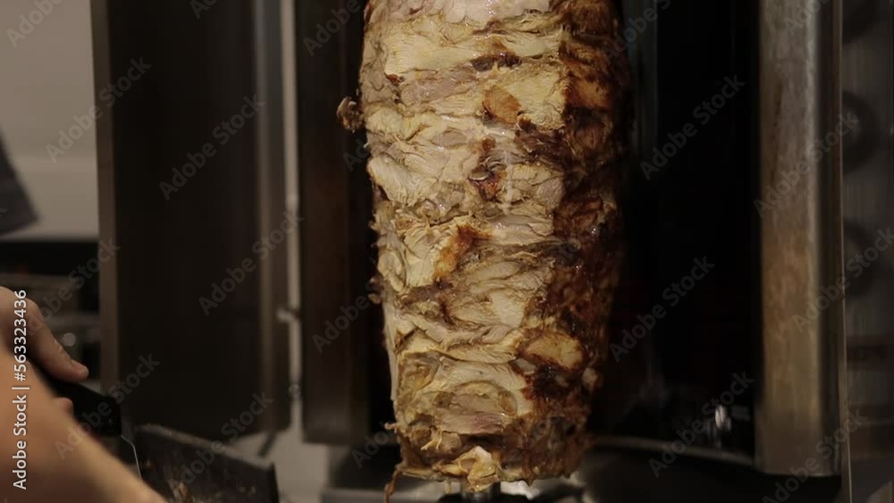 Cooking meat on a skewer. doner on a spit. Turkish doner, kebab. Doner ...