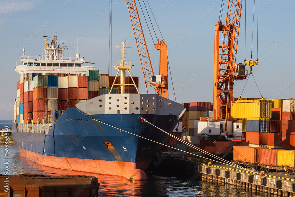 container ship uploading in commercial dock harbor Stock Photo | Adobe ...