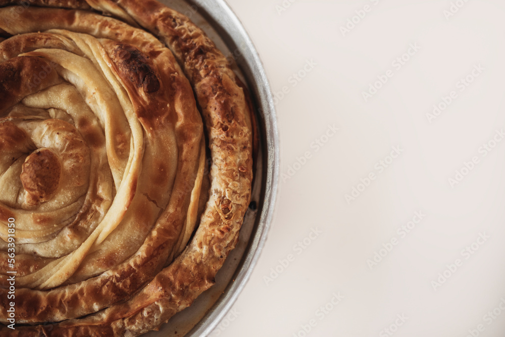 on a white background Turkish Tepsi Boregi, Round Borek, Tray pastry ...