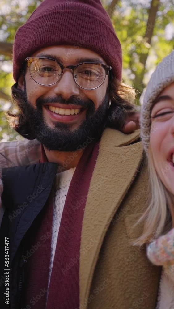Vertical video of Multiracial people together looking camera in a ...