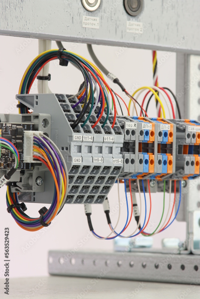 Electrical terminals with connected mounting wires marked with ...