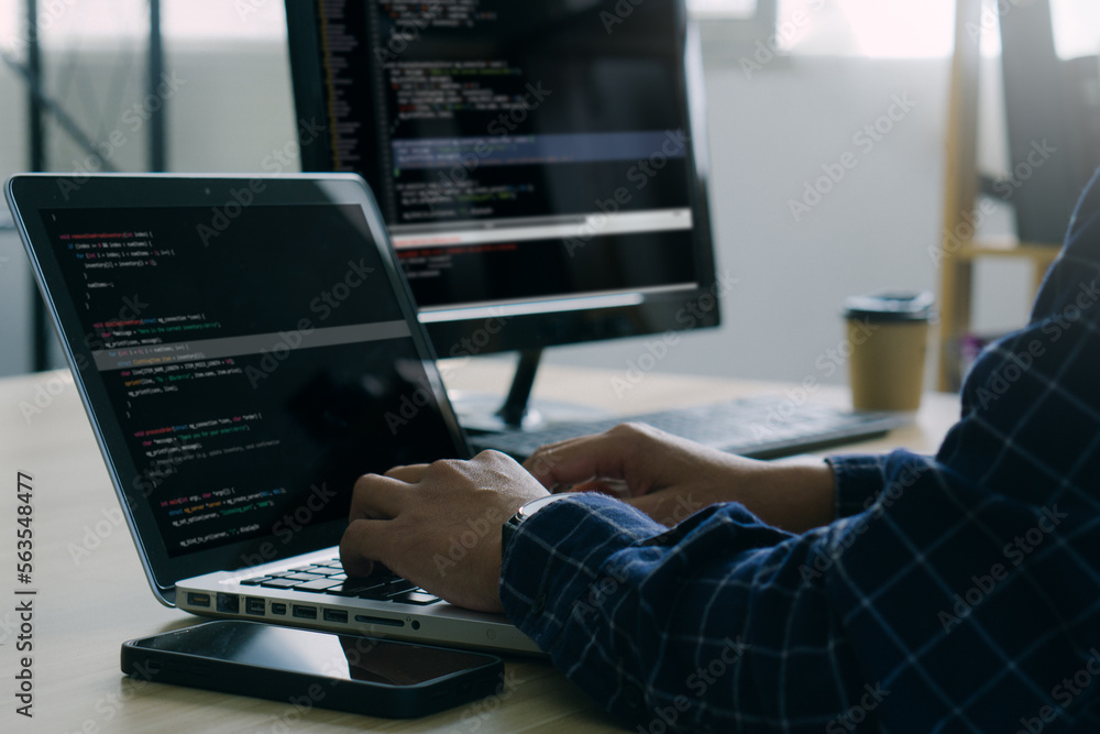 Computer programmer working on new software program.Coder recruited for solve all the script ...