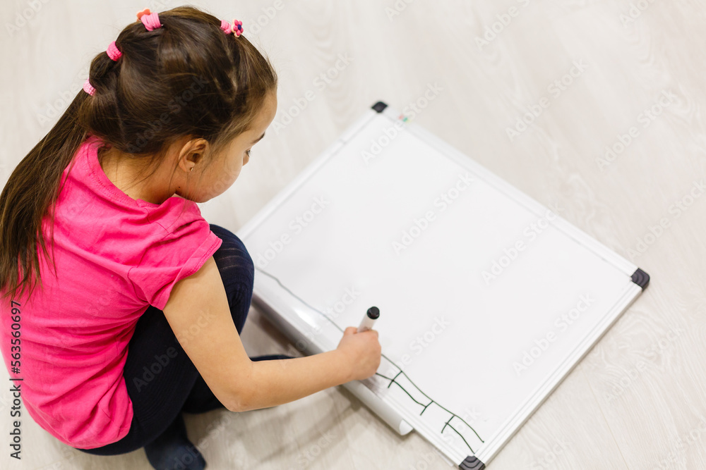 little girl writing on the white board, schooling background Stock ...