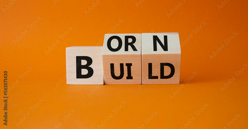 Born and Build symbol. Turned wooden cubes with words Build to Born ...