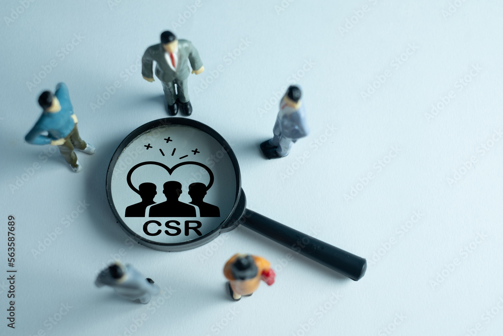 Group of Business people looking magnifying glass with CSR (Corporate ...