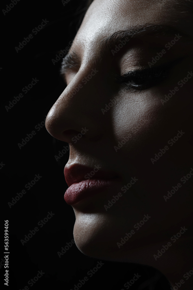 Fashion and make-up concept. Close-up dark face silhouette of looking ...