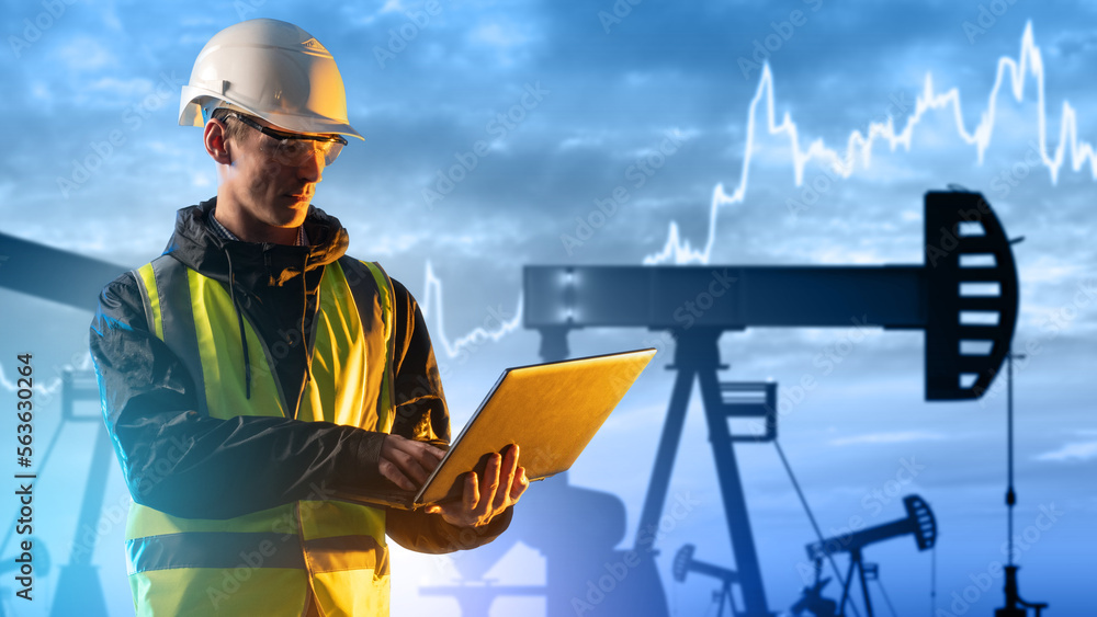 Man with laptop in oil field. Fuel company trader. Guy monitors level ...