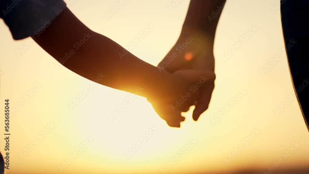 happy family. Mom lends helping hand to her daughter girl in nature in ...