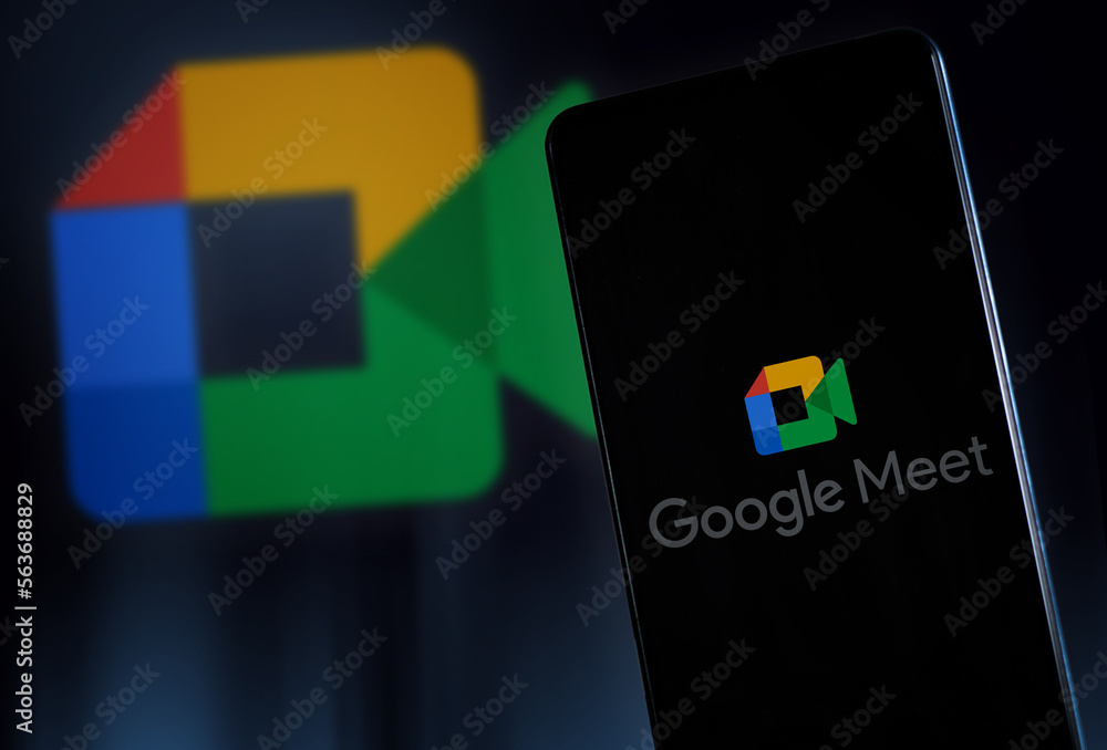 Google Meet logo on smartphone display and background. Milan Italy ...