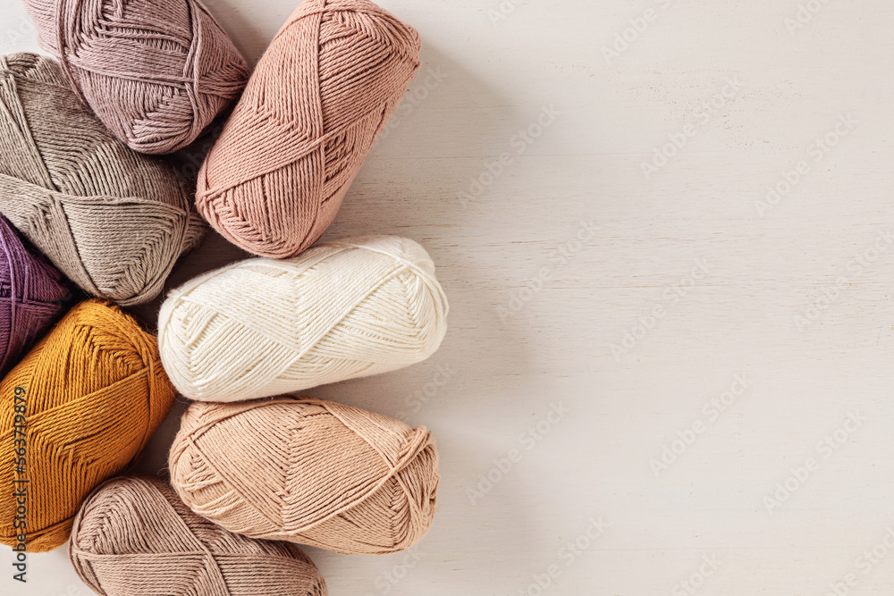 Craft knitting hobby background with yarn in natural colors ...
