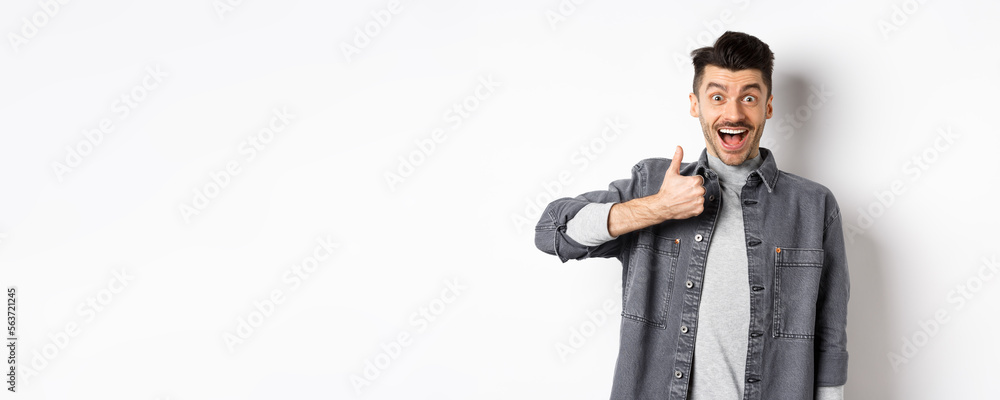 Well done, very good. Excited handsome guy praising nice work, showing ...