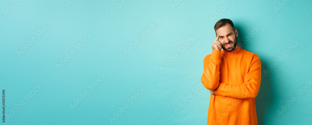 Man with beard, grimacing and cringe from something embarrassing ...