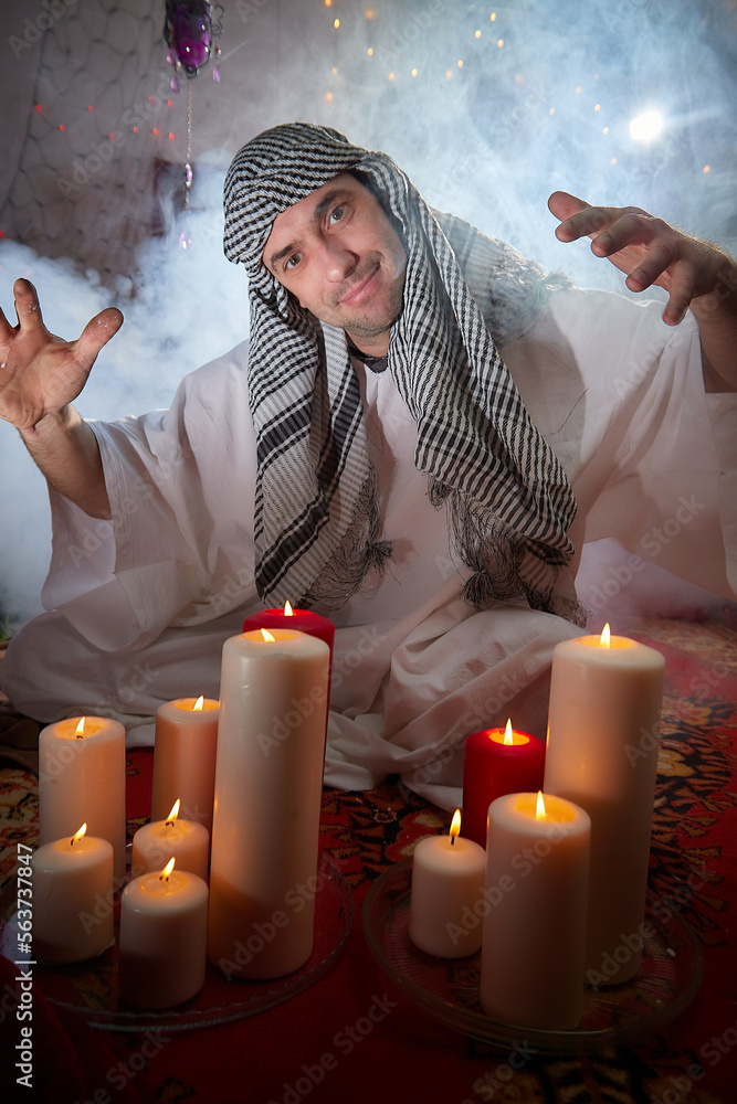 Arab sheikh in white robe and headscarf in boudoir in room with red ...
