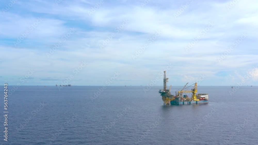 An aerial view from a drone of a tender drilling oil rig (Barge Oil Rig ...