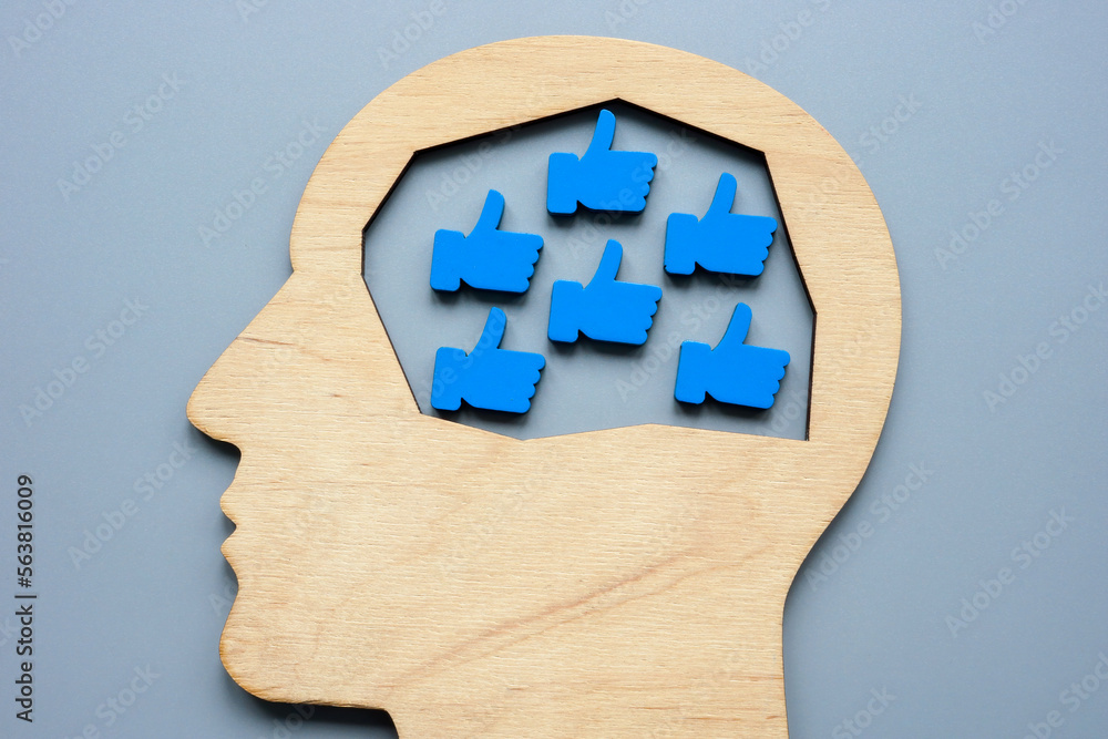 Head with like symbols inside as concept of social media and popularity ...