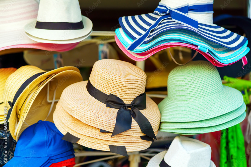 Beach hats of various shapes and styles are put up for sale Stock Photo ...