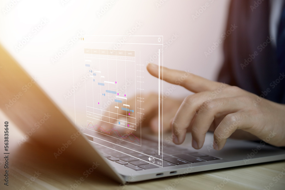 Male manager managing business planning project schedule in the office ...