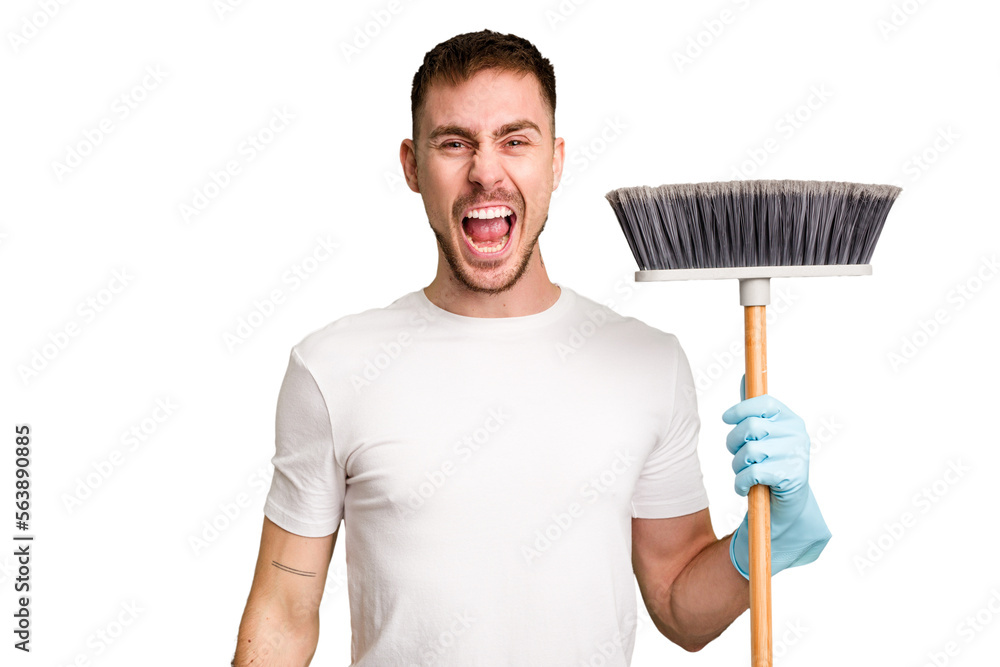 Young man holding a broom to clean his house cut out isolated screaming ...