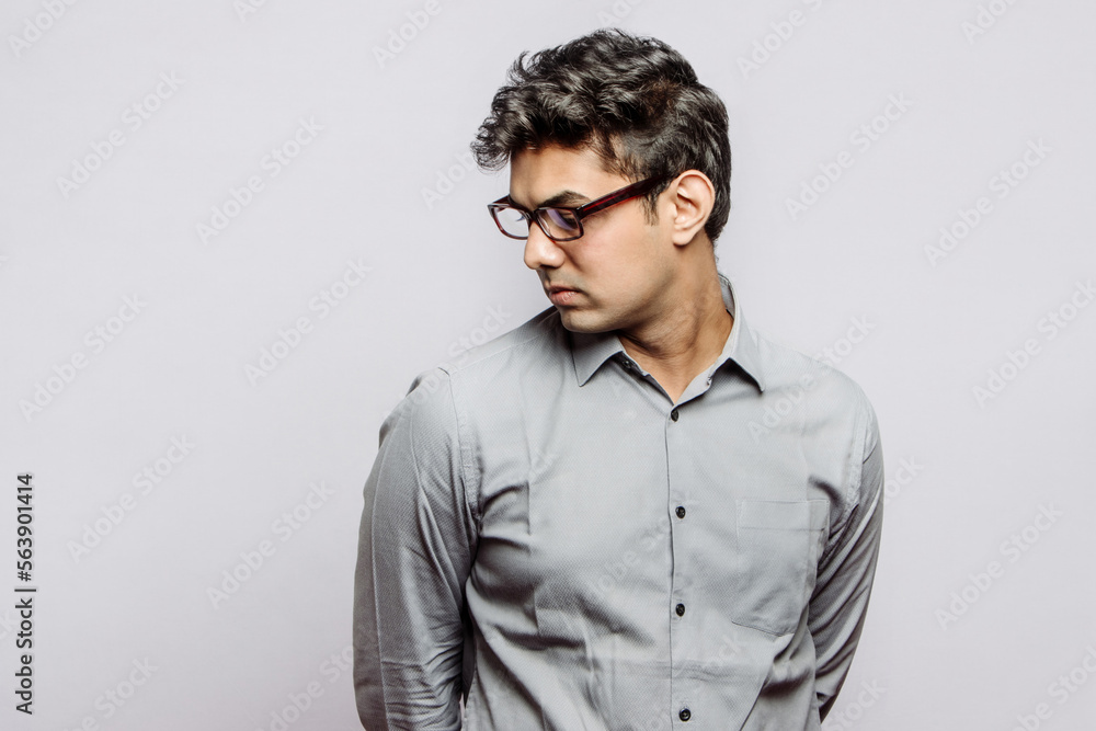 Male model posing in formal wear and eye wear looking sideways with ...