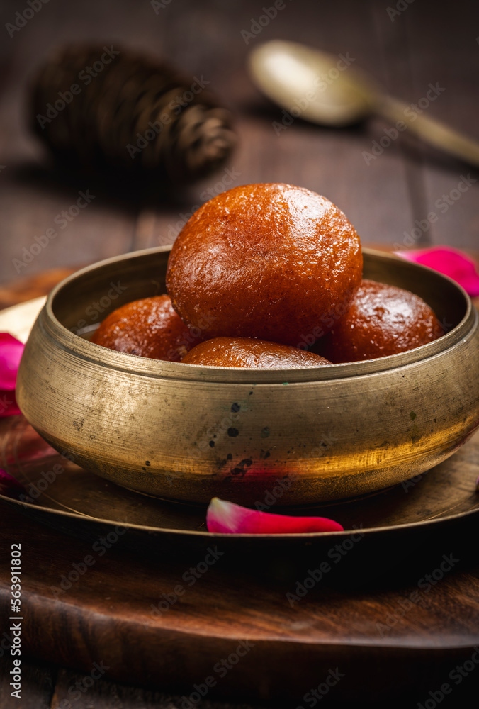 Gulab jamun is made with deep-fried balls of milk base dough soaked in ...