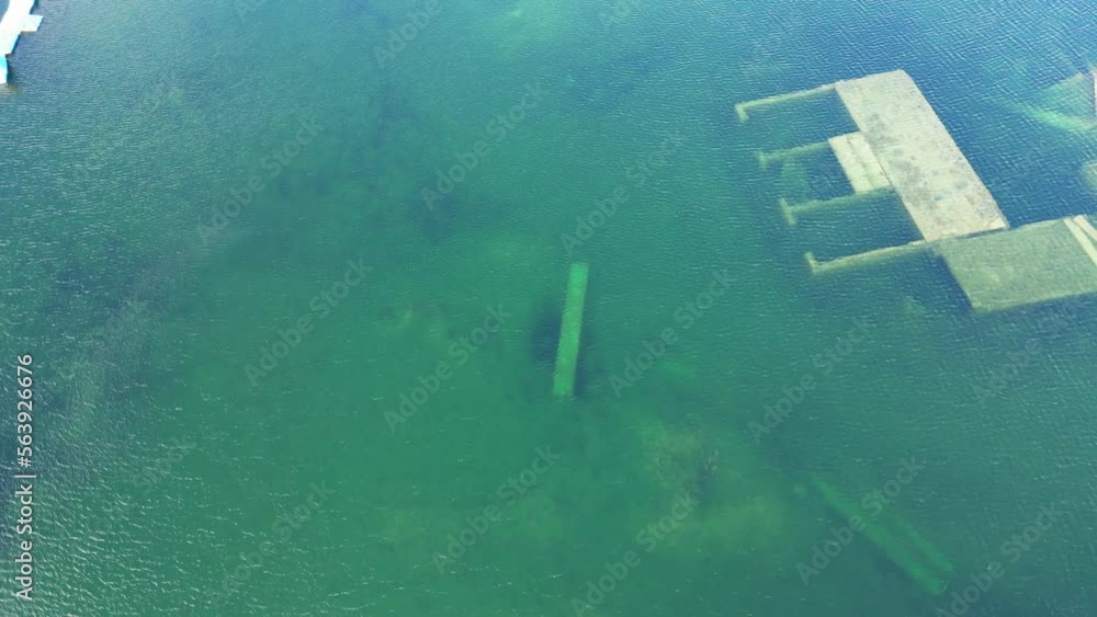 Village flooded and submerged underwater. Abandoned Rummu quarry ...