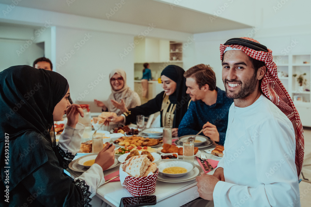 Muslim family having Iftar dinner drinking water to break feast. Eating ...