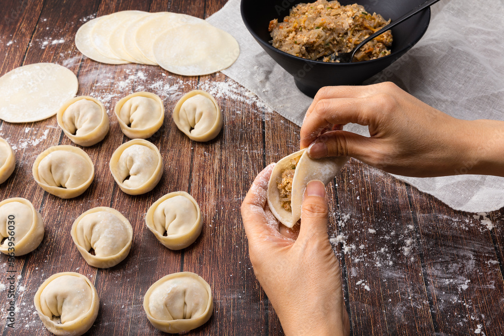 Korean handmade dumplings. Knead the flour by hand to make dumplings ...