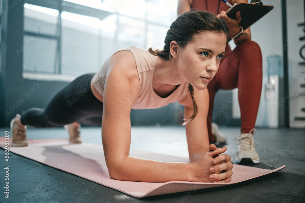 Fitness, plank and personal trainer with a sports woman training in a ...