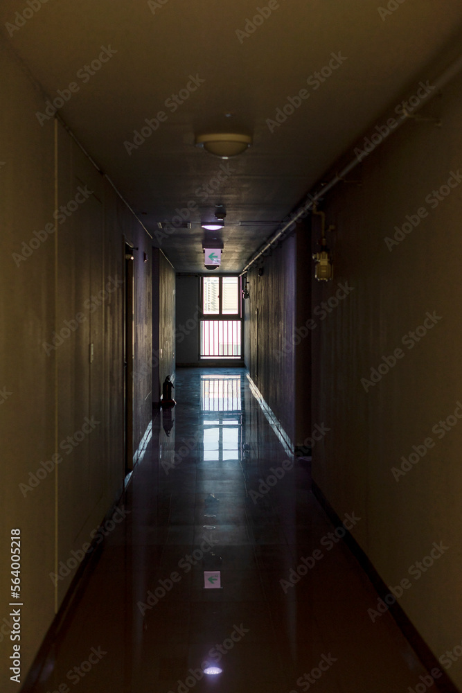 Emergency exit sign at the hallway of building Stock Photo | Adobe Stock
