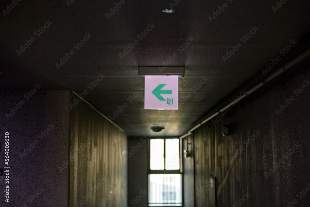 Emergency exit sign at the hallway of building Stock Photo | Adobe Stock