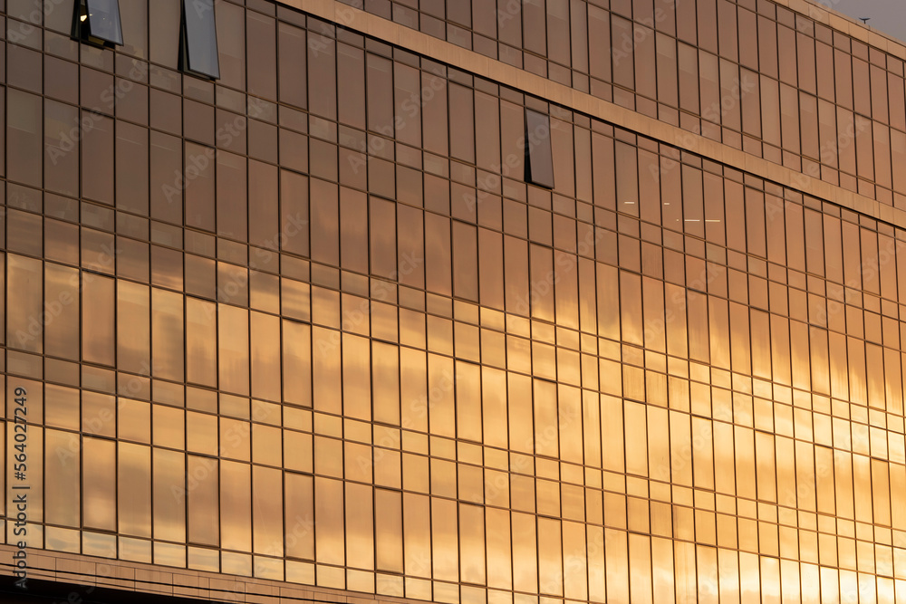 Modern office building facade. Tall business center with a glass facade ...