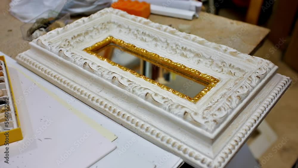 Repair of the antique picture frame by restorer, work with gaps in ...