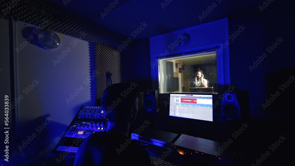 Modern professional studio for music recording. Sound engineer is ...