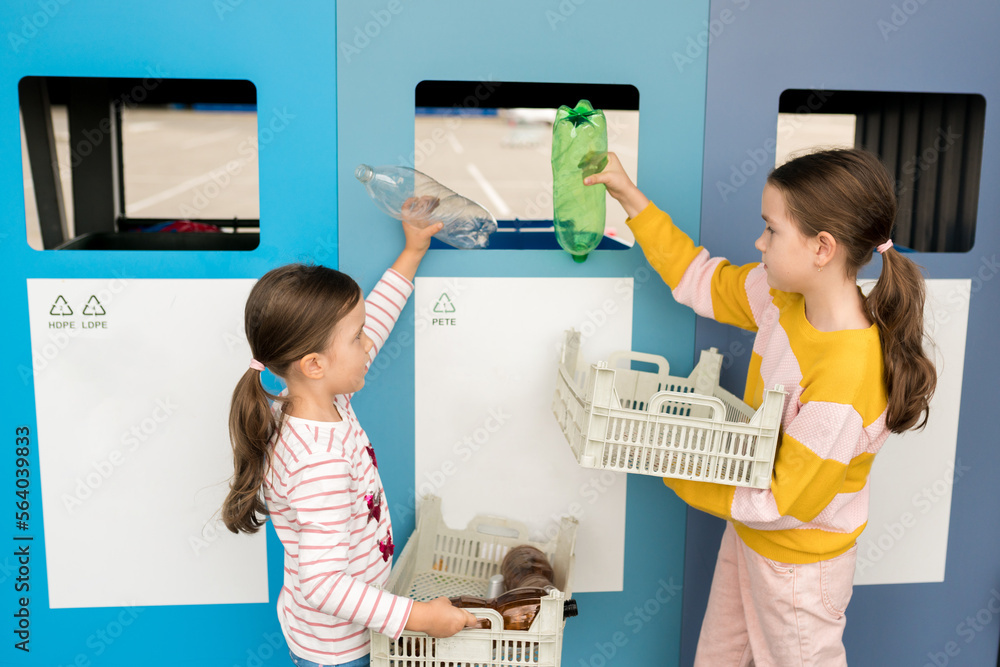 Kids sorting plastic by polymer type and taking out plastic trash in ...