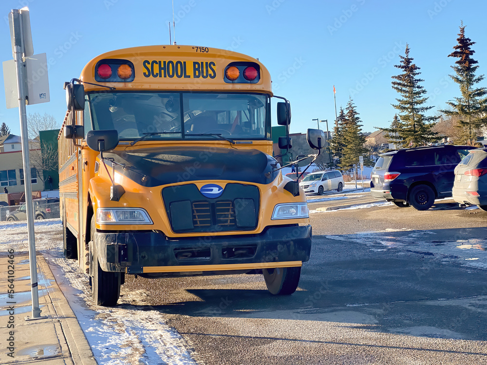 Calgary, Alberta, Canada. Jan 23, 2023. A School bus park by a public ...