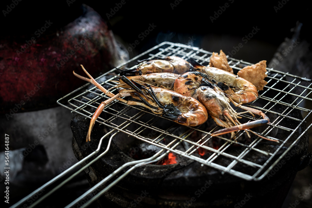 Grilling fresh River Prawn on iron grill on vintage stove,some menu ...