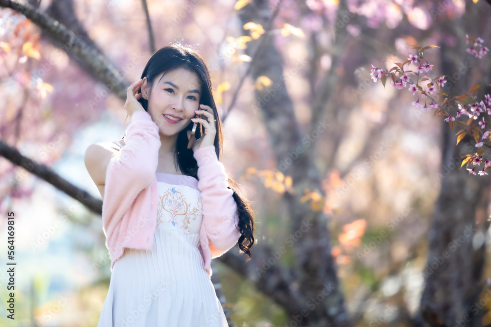Beautiful woman using smartphone, talking, typing message, chatting ...