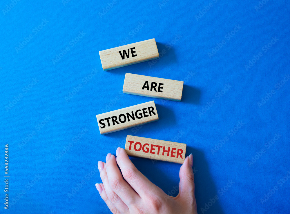We are stronger together symbol. Wooden blocks with words We are ...