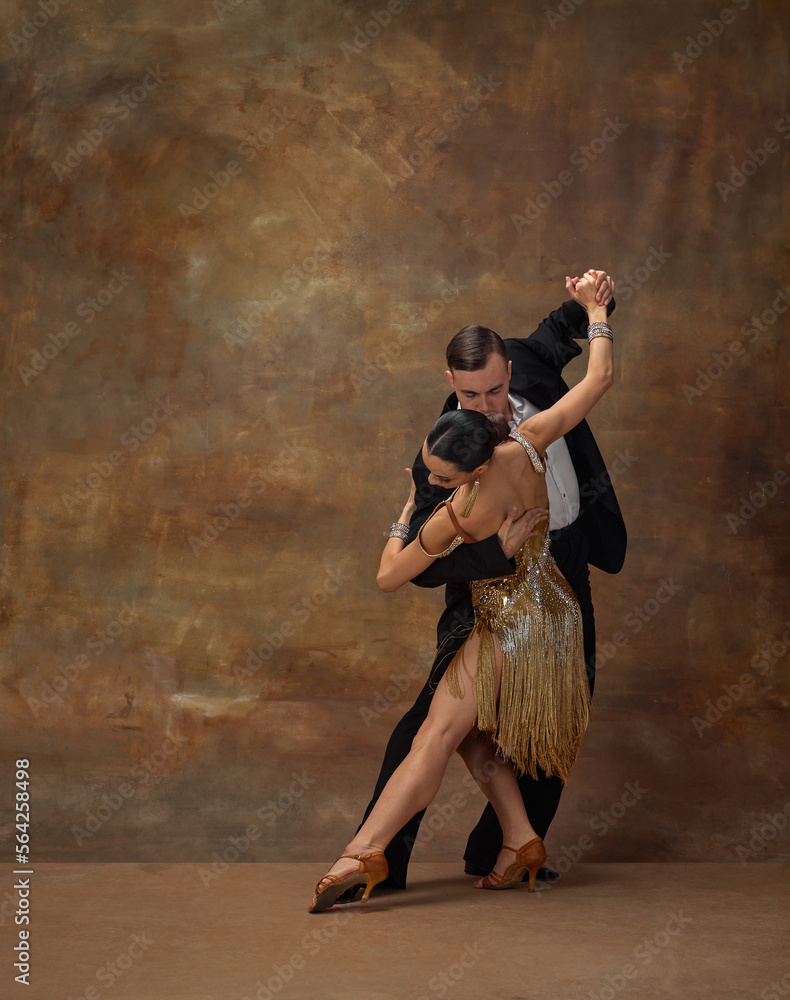 Femininity and masculinity. Man and woman, professional tango dancers in stylish, beautiful ...