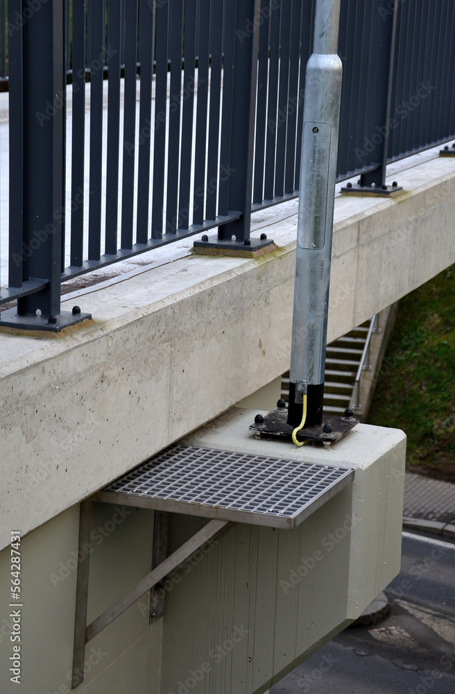 railing at the bridge with vertical fence bars anchored to the ground ...