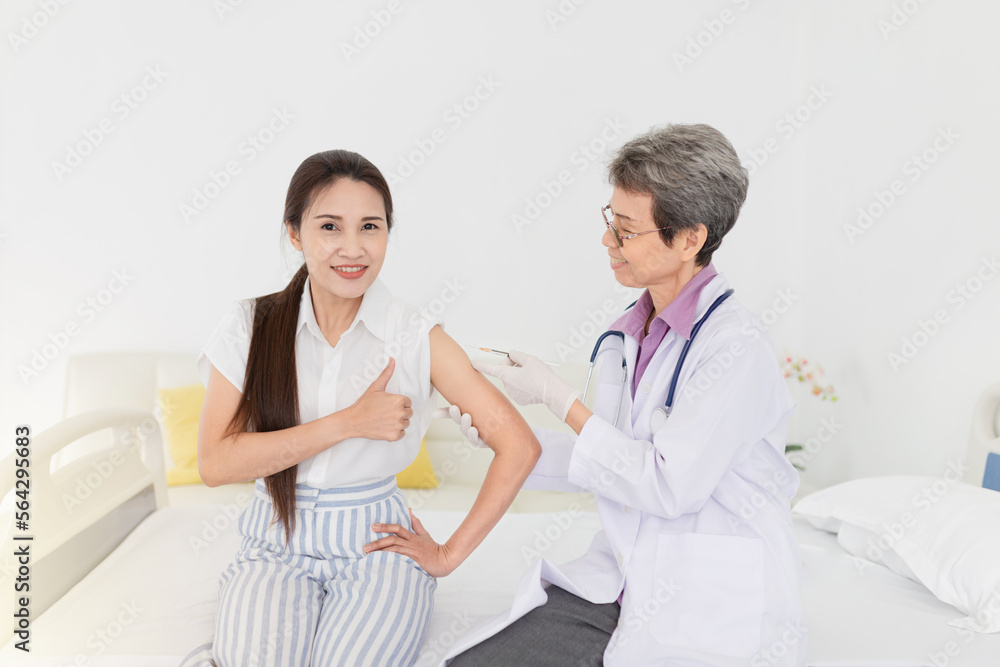 doctor inject vaccine to asian woman, Deltoid muscle injection ...