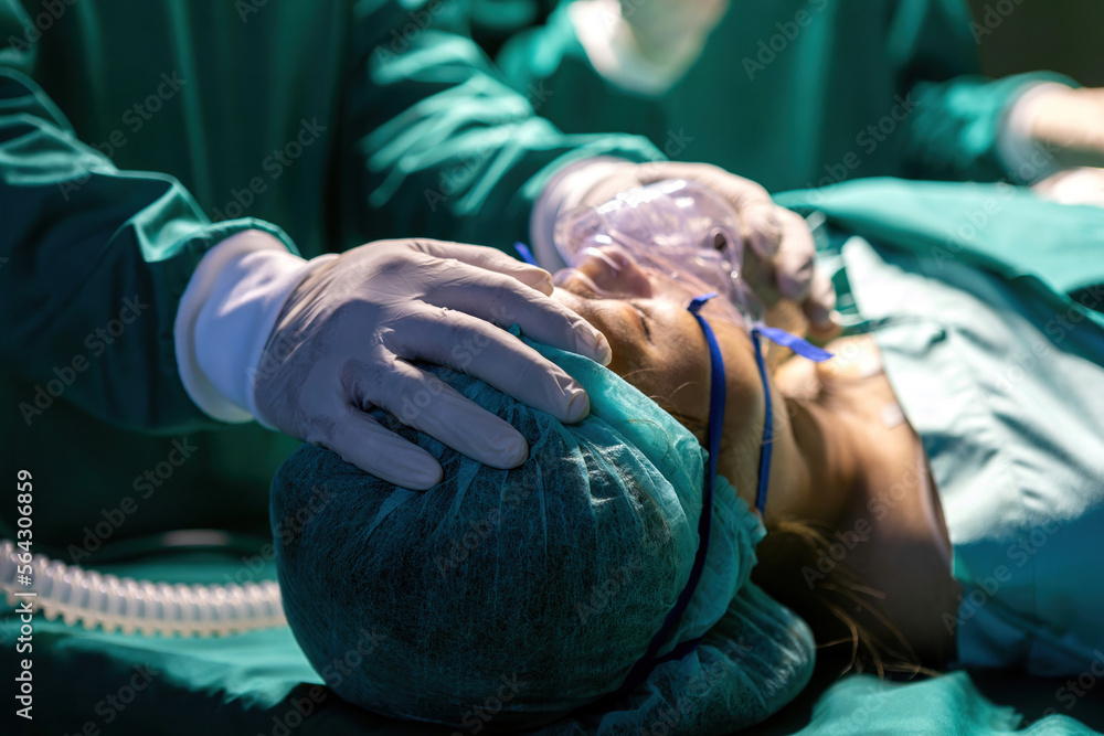 patient wearing oxygen mask lying sleeping after getting anesthesia ...
