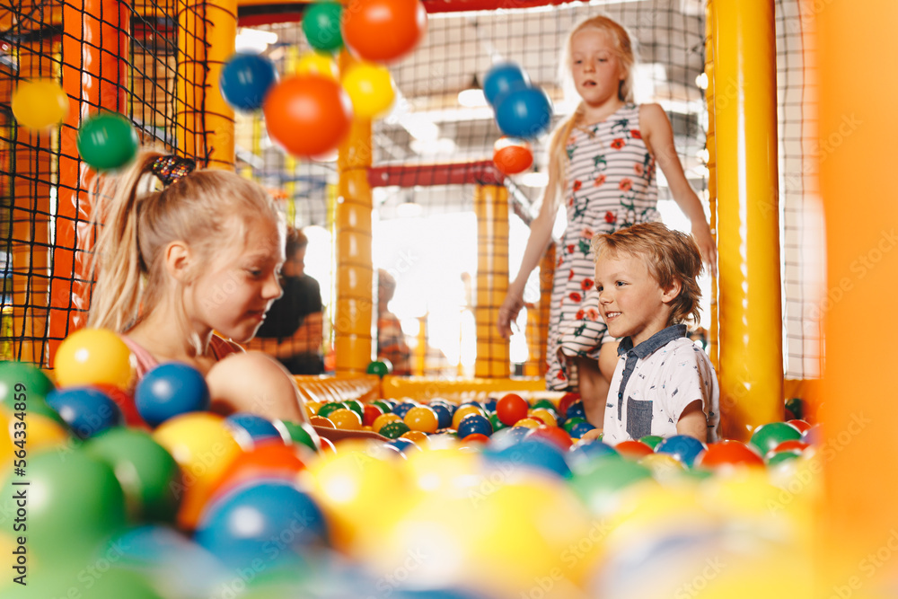 Happy Children Playing in Ball Pool. Kids Having Fun in Playground Ball ...
