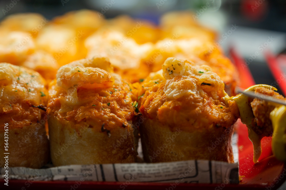 Typical snack of Basque Country, pinchos or pinxtos skewers with small ...